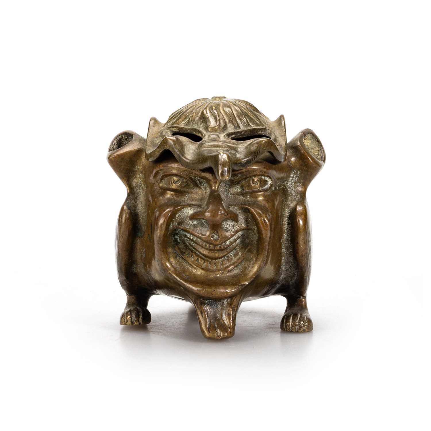 Lot 570 - A BRASS INKWELL IN THE FORM OF A GROTESQUE