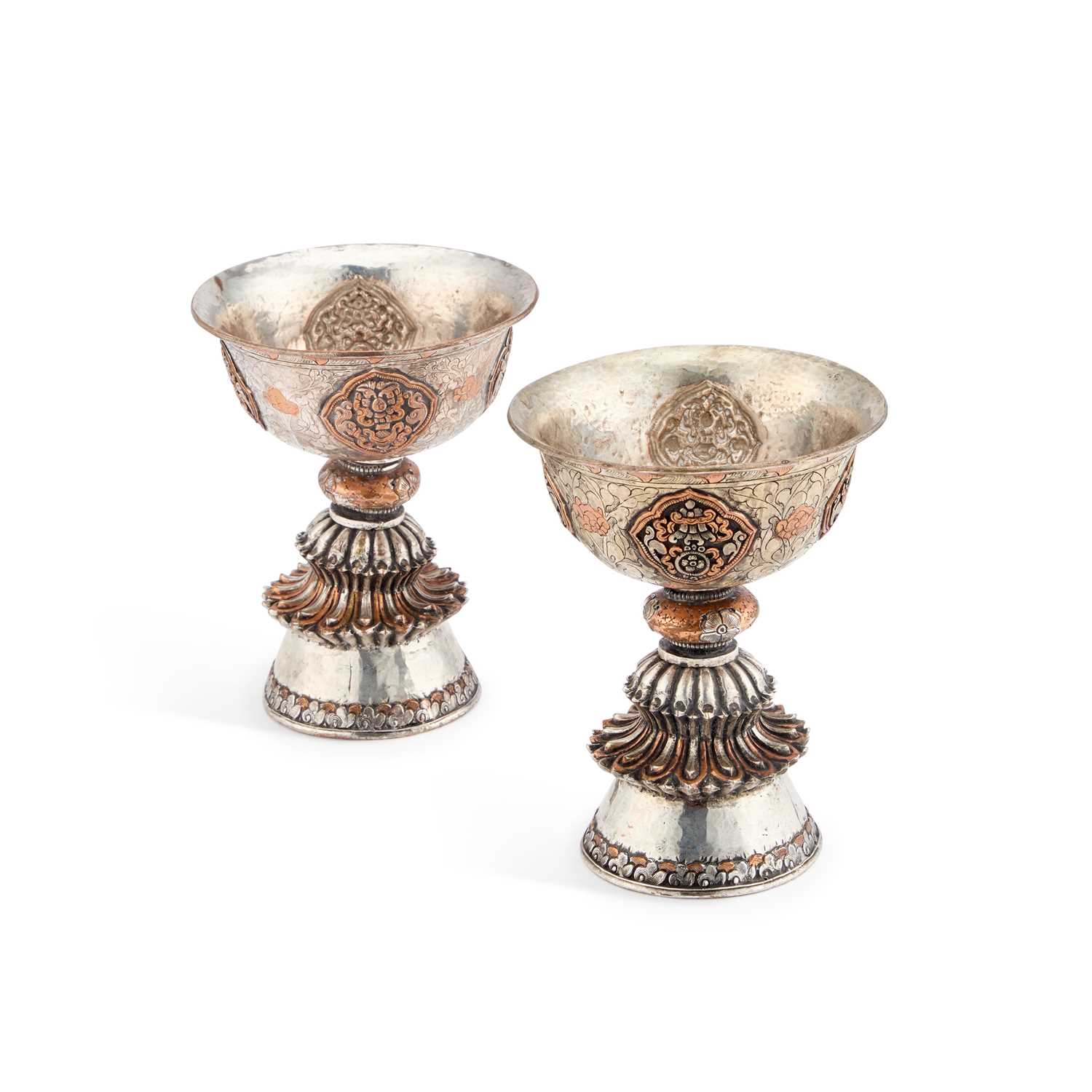 Lot 349 - A PAIR OF TIBETAN DIPA SILVER ON COPPER