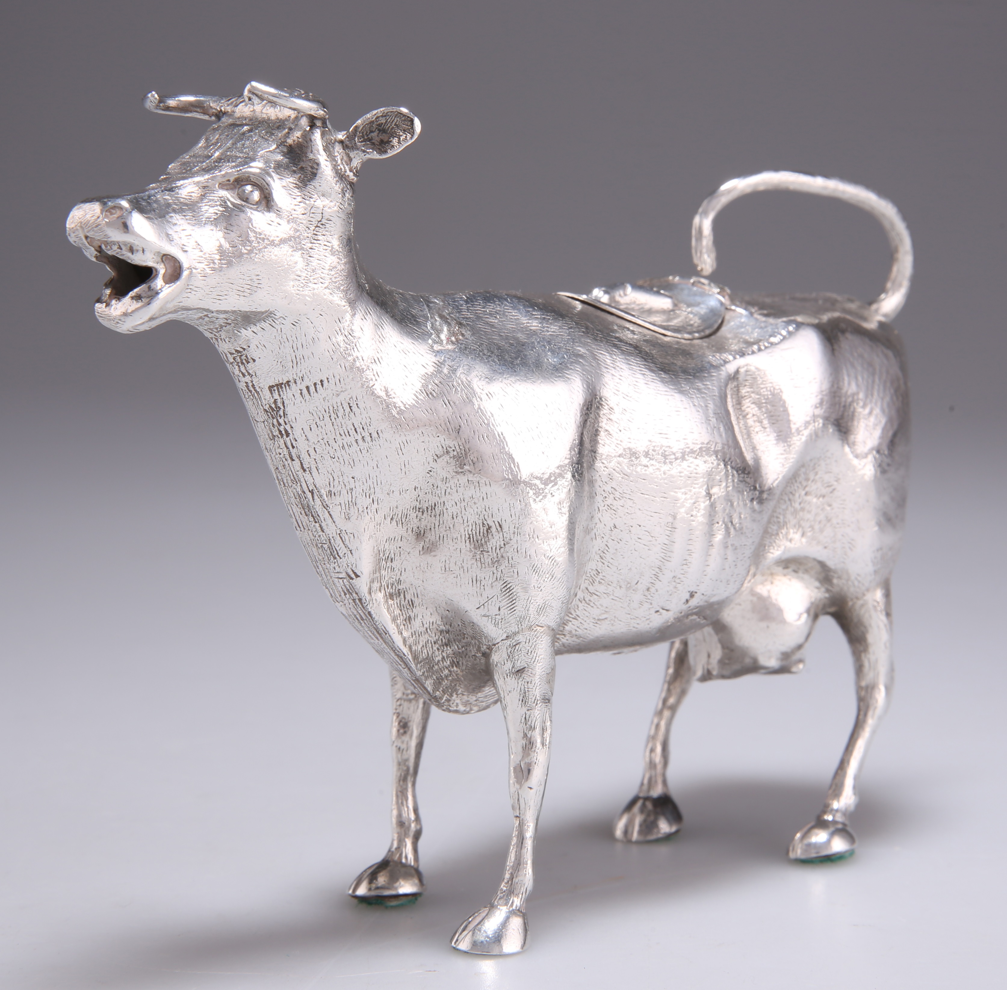 Lot 1194 - AN ELIZABETH II SILVER COW CREAMER