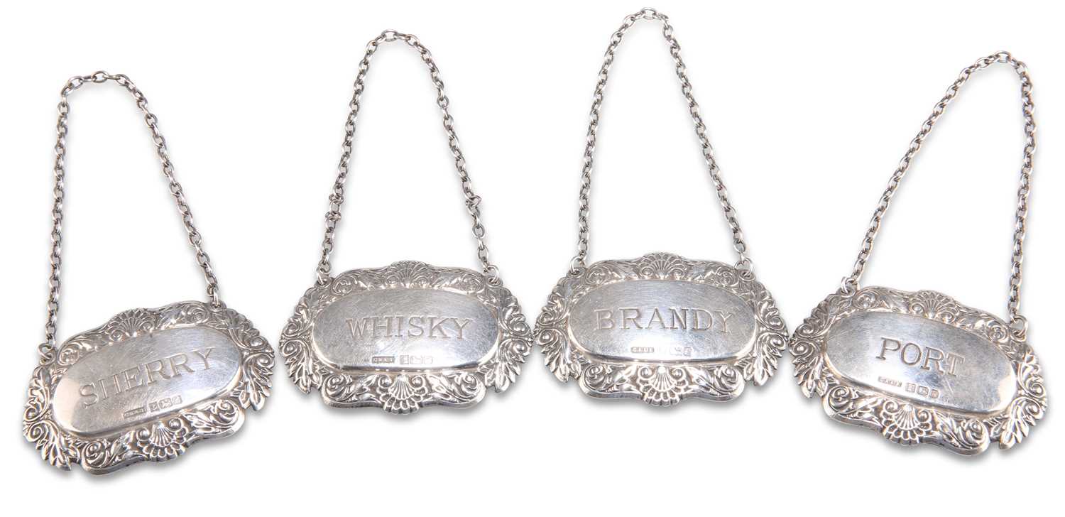 Lot 1177 - A SET OF FOUR SILVER DECANTER LABELS