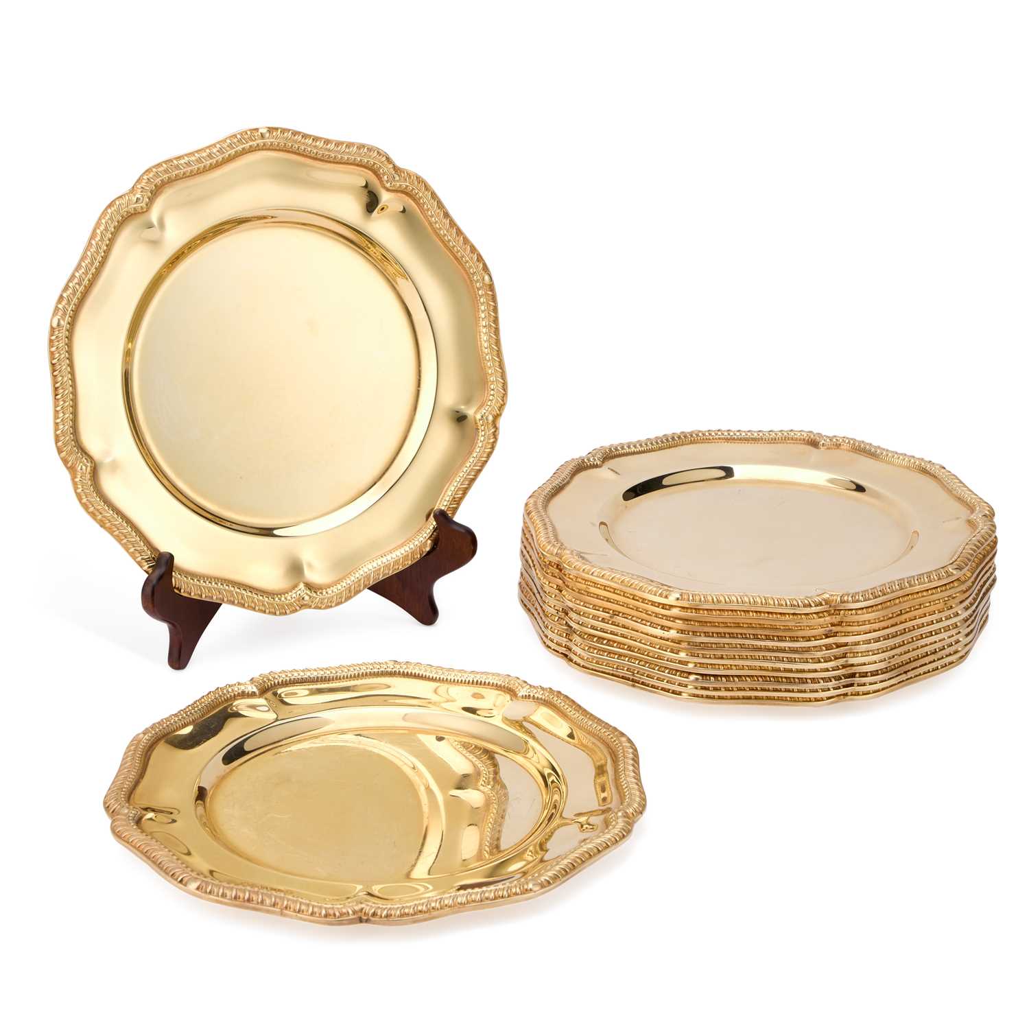 Lot 99 - A SET OF TWELVE GILT SILVER-PLATE DINNER