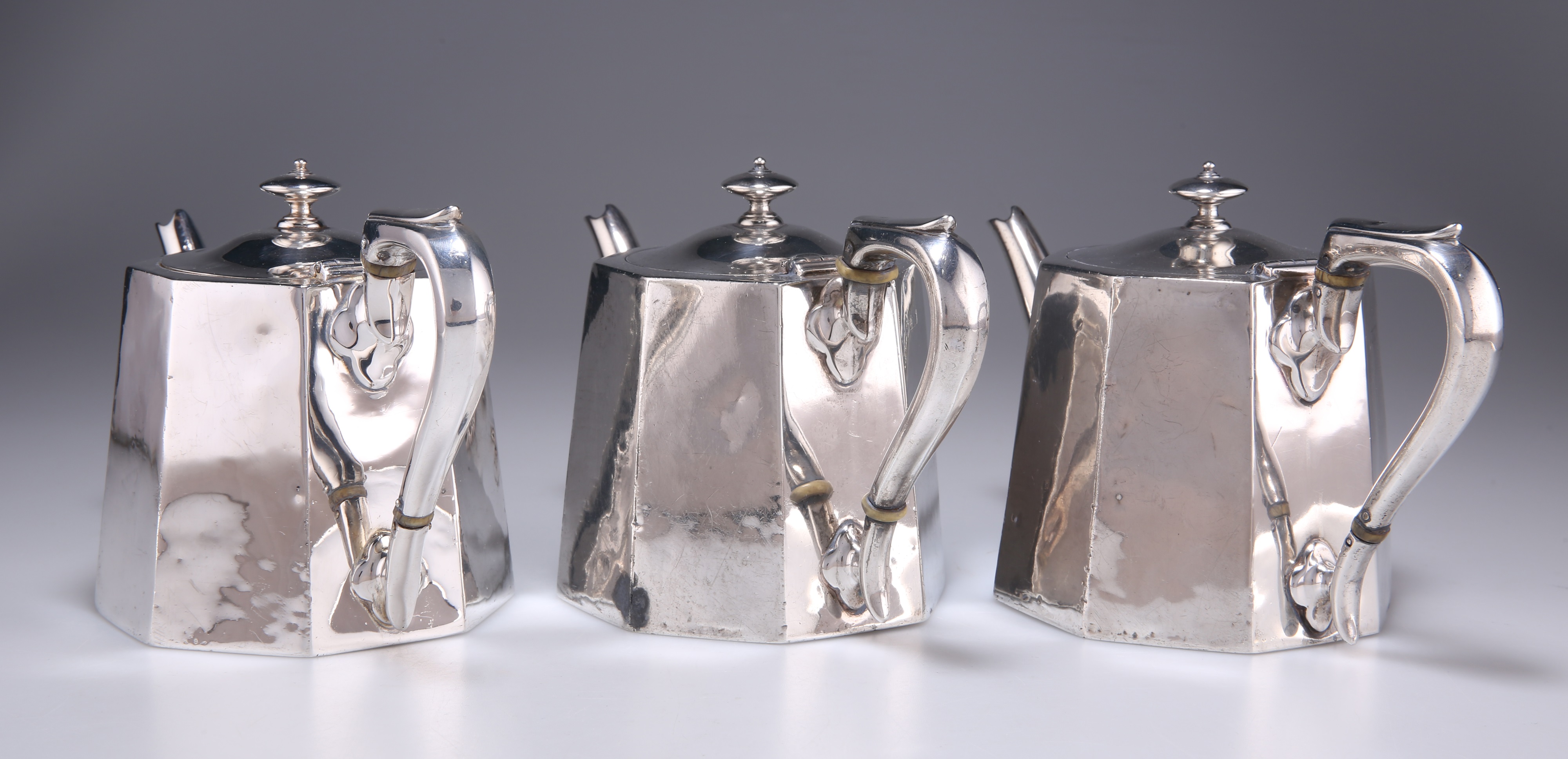 Lot 1353 - † A TRIO OF EDWARDIAN SILVER TEAPOTS