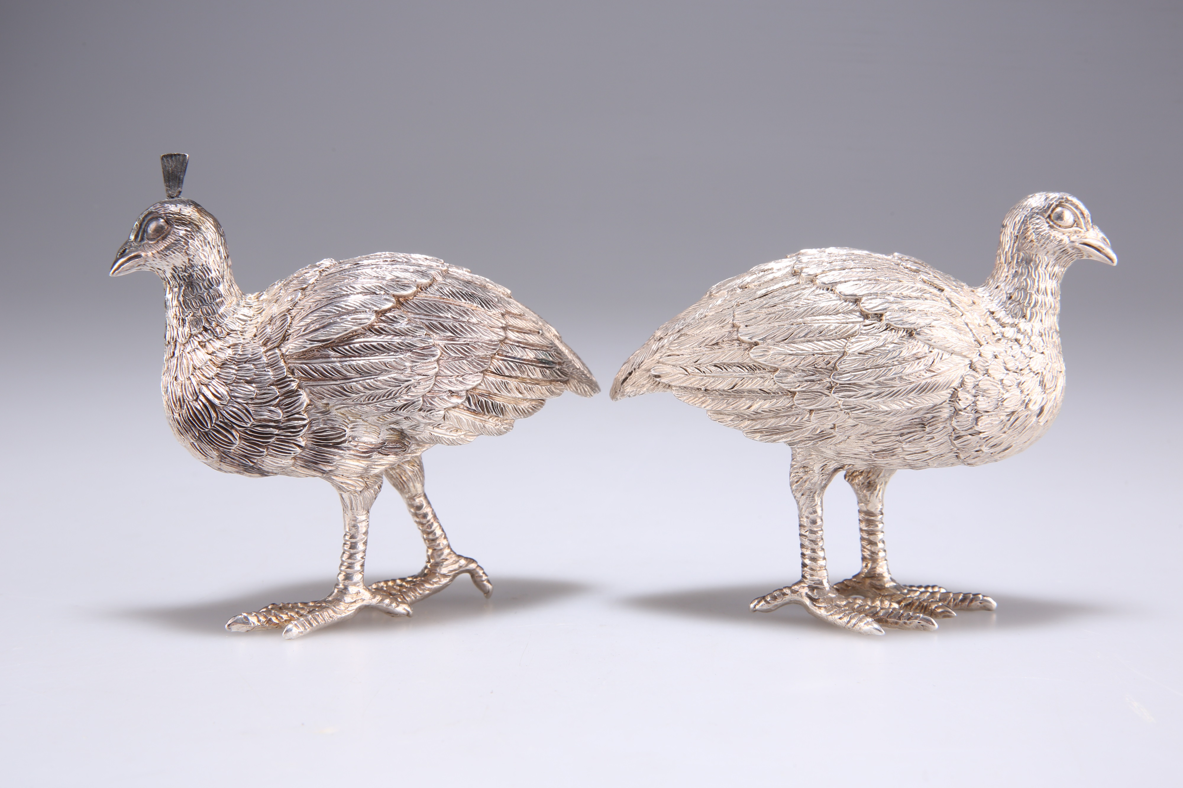 Lot 1066 - A PAIR OF SILVER MODELS OF BIRDS