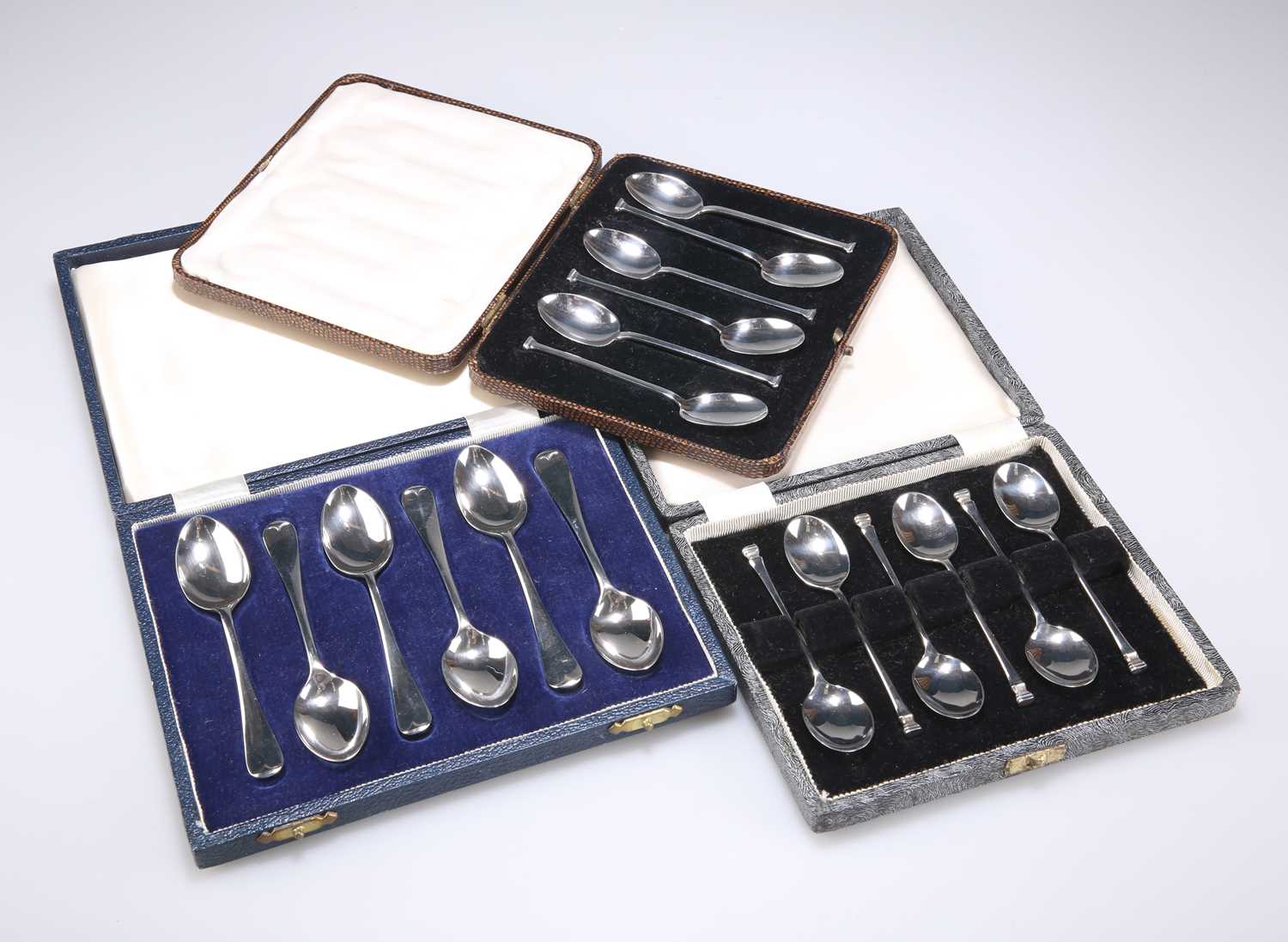 Lot 1065 - THREE CASED SETS OF SIX SILVER TEASPOONS,