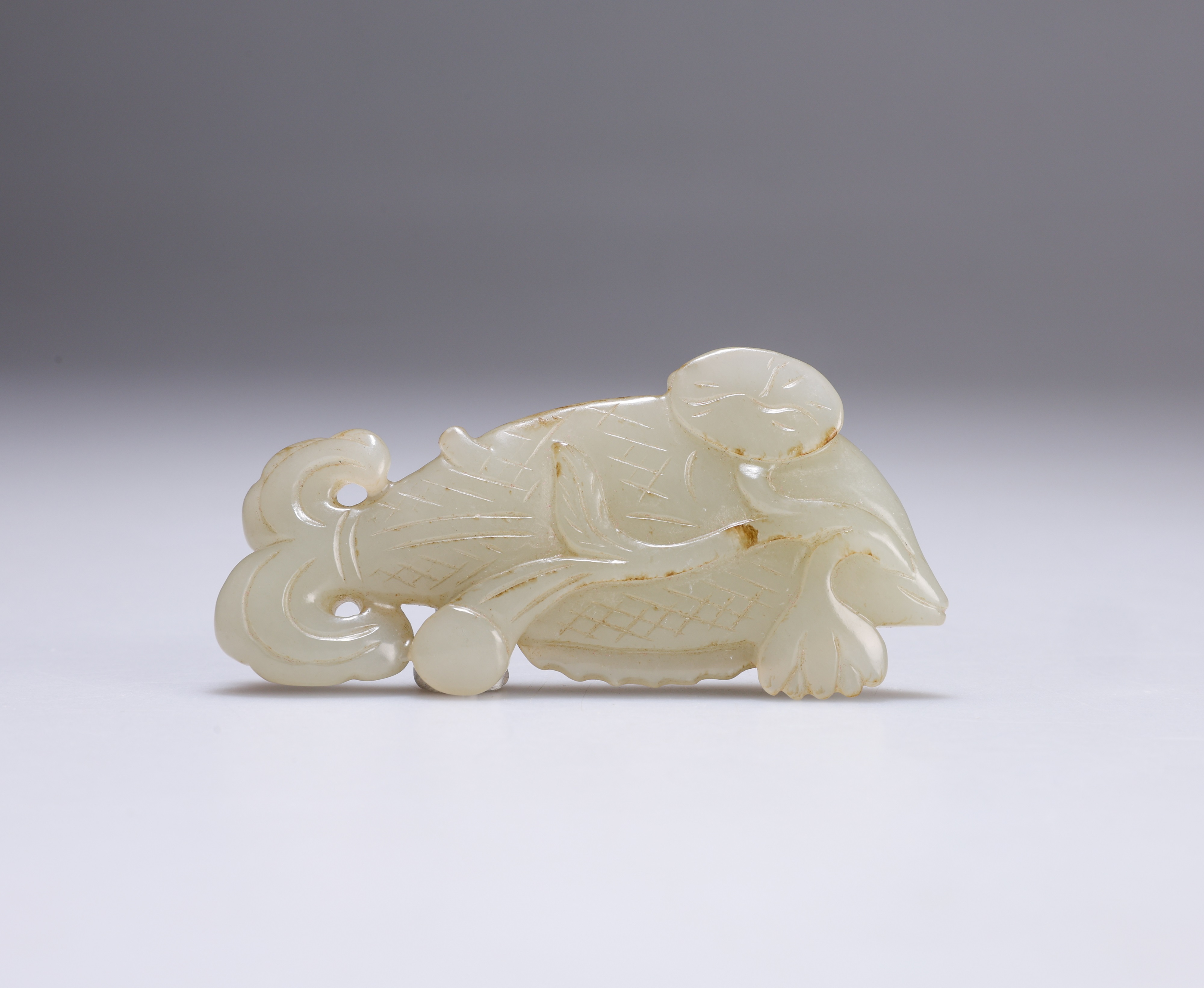 Lot 641 - A CHINESE JADE FISH PENDANT